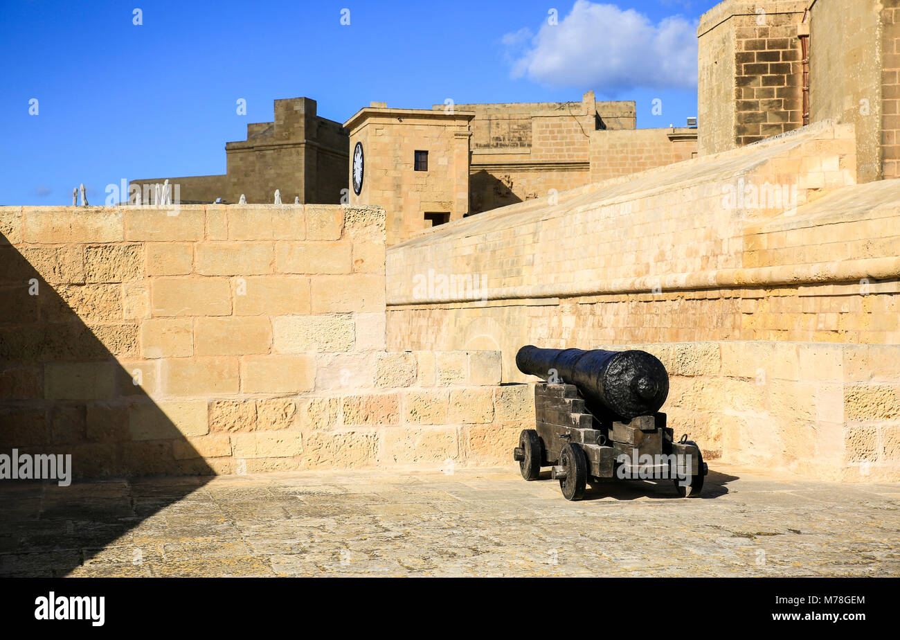 A cannon inside the walls of the Ancient Citadel in Gozo Stock Photo ...