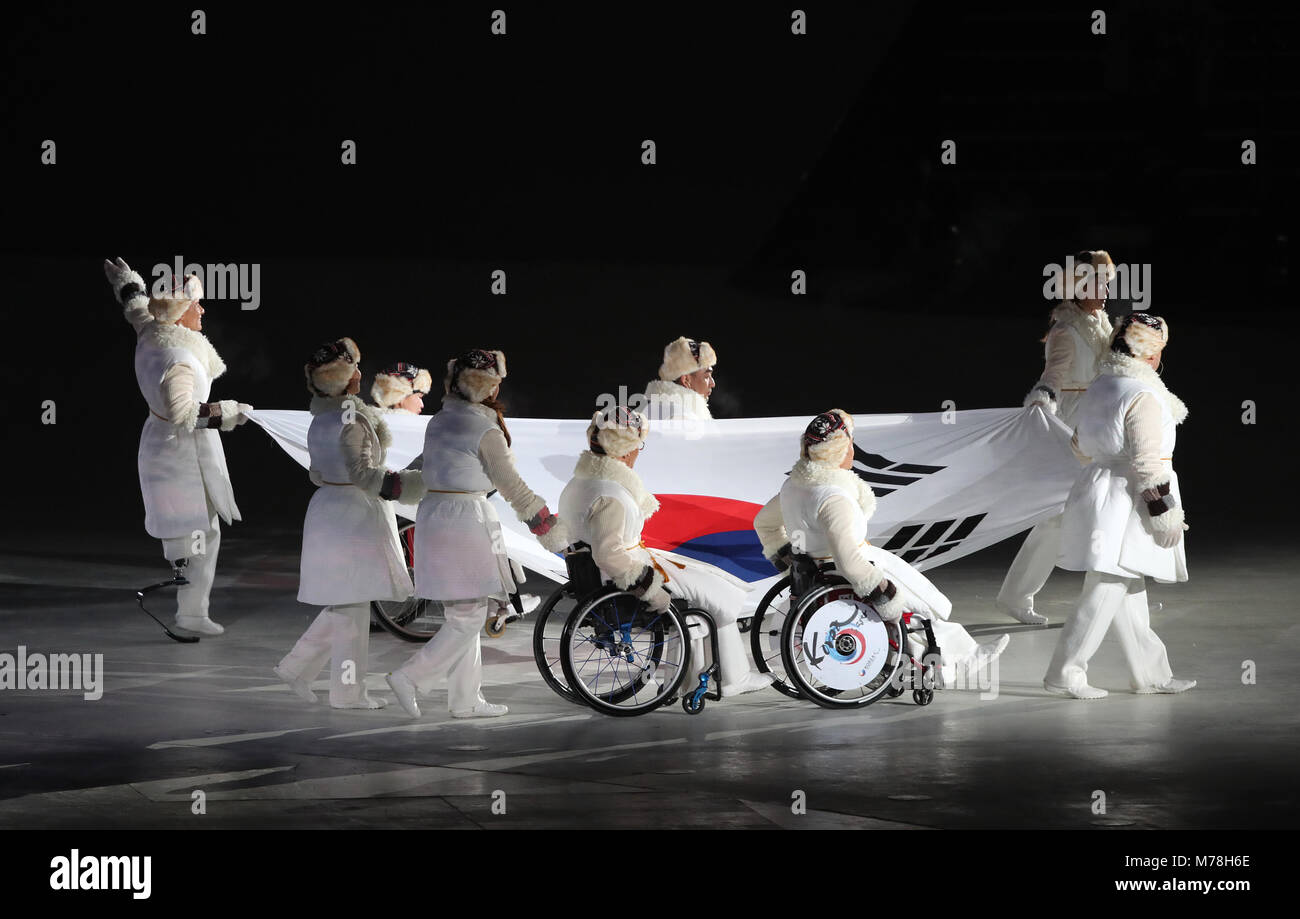 Past winners from South Korea Olympic teams carry a flag during the ...