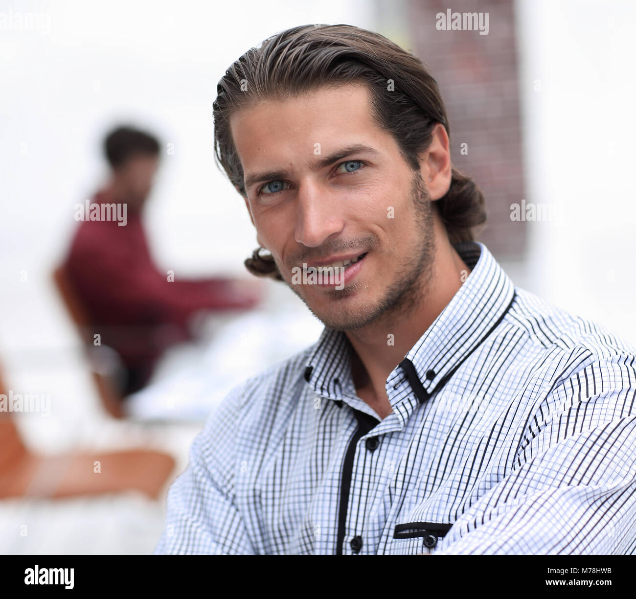 portrait of a successful man in the background of the office Stock ...