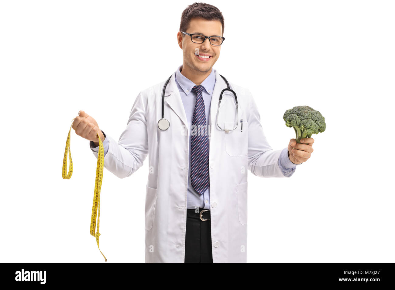 Doctor holding a measuring tape and broccoli isolated on white ...