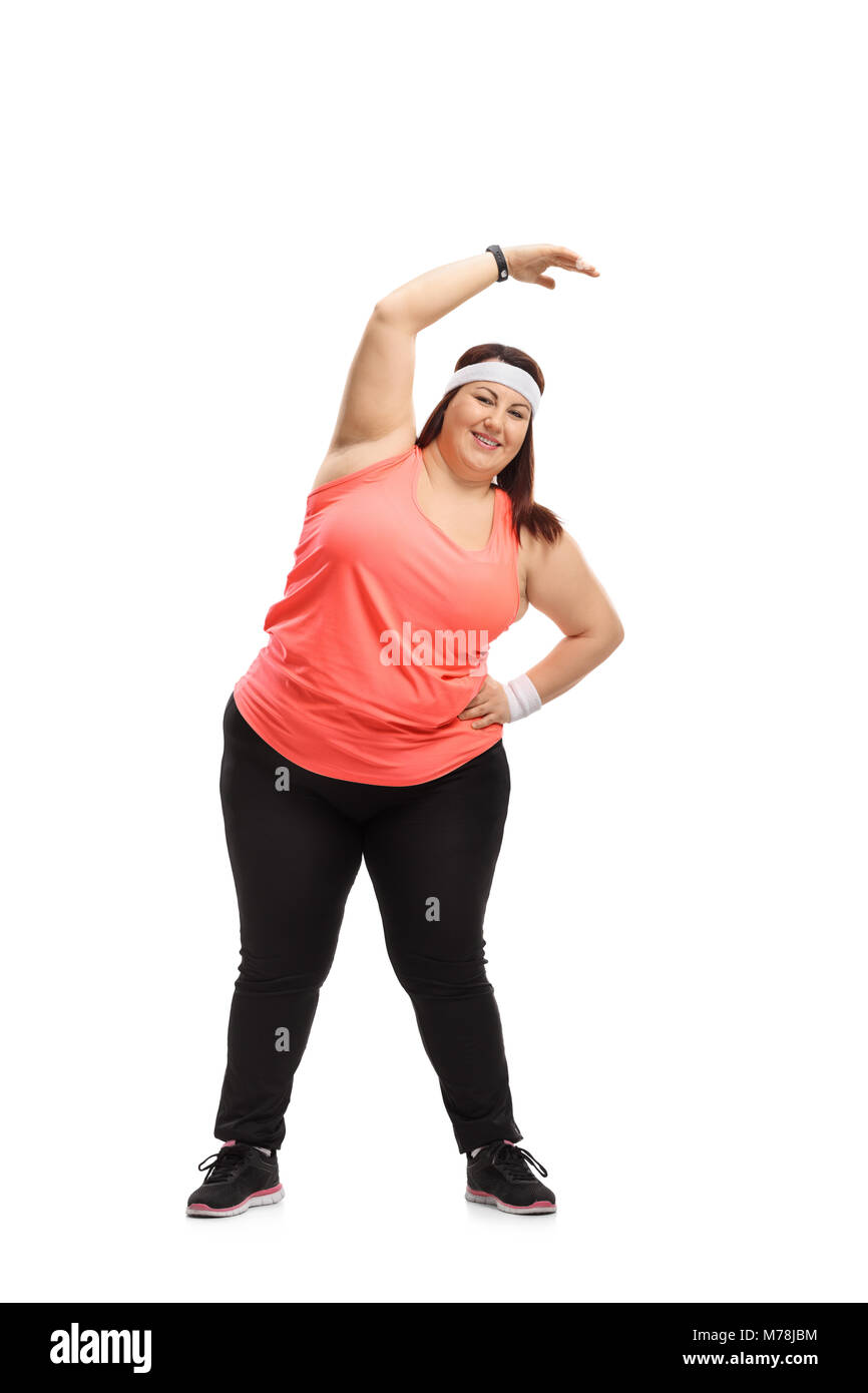 Full length portrait of an overweight woman exercising isolated on ...