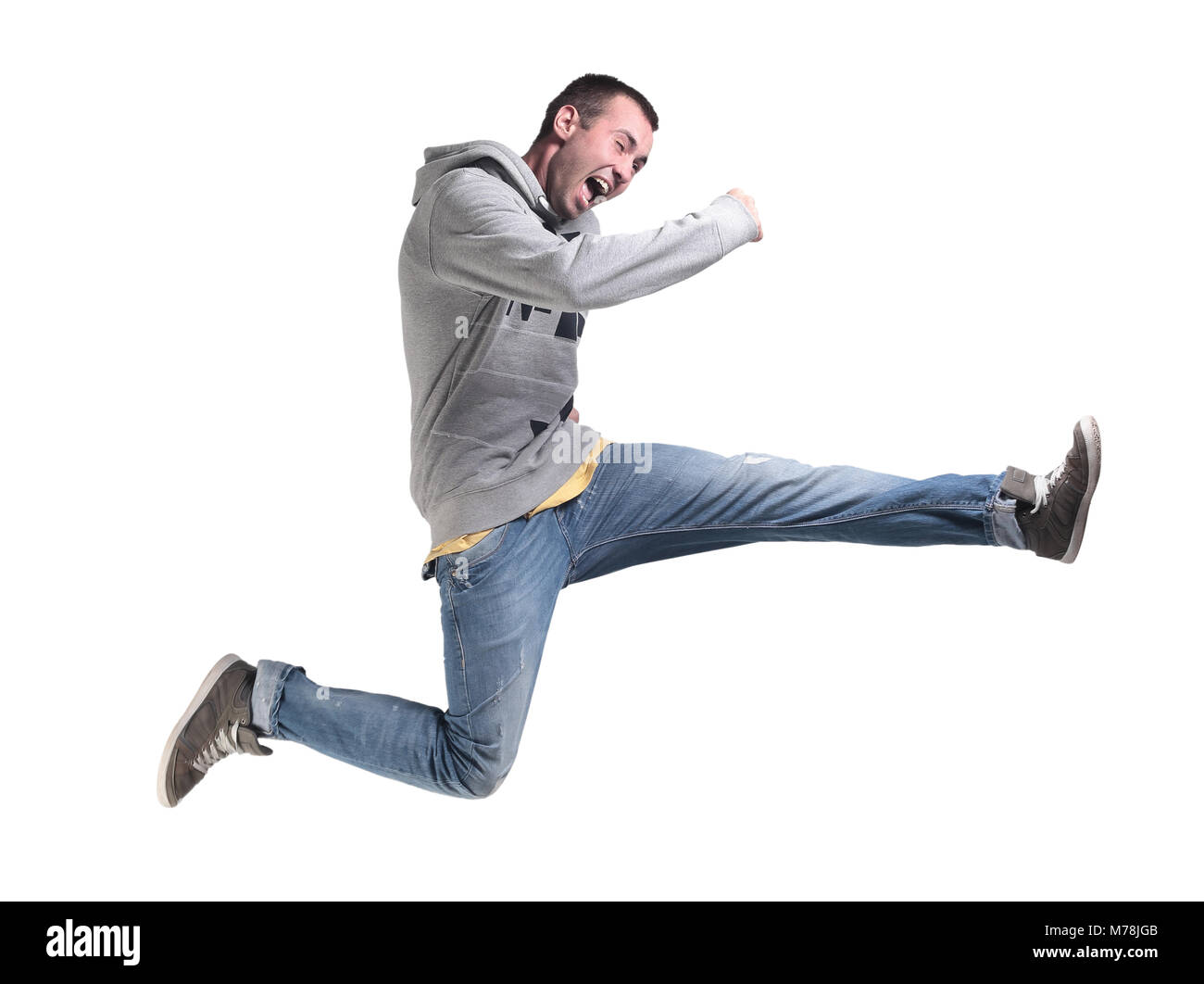 Funny cheerful happy man jumping in air over white background Stock ...