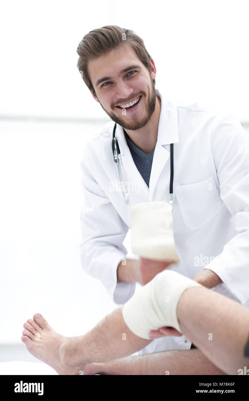 doctor treats the patient's leg.the concept of recovery Stock Photo - Alamy