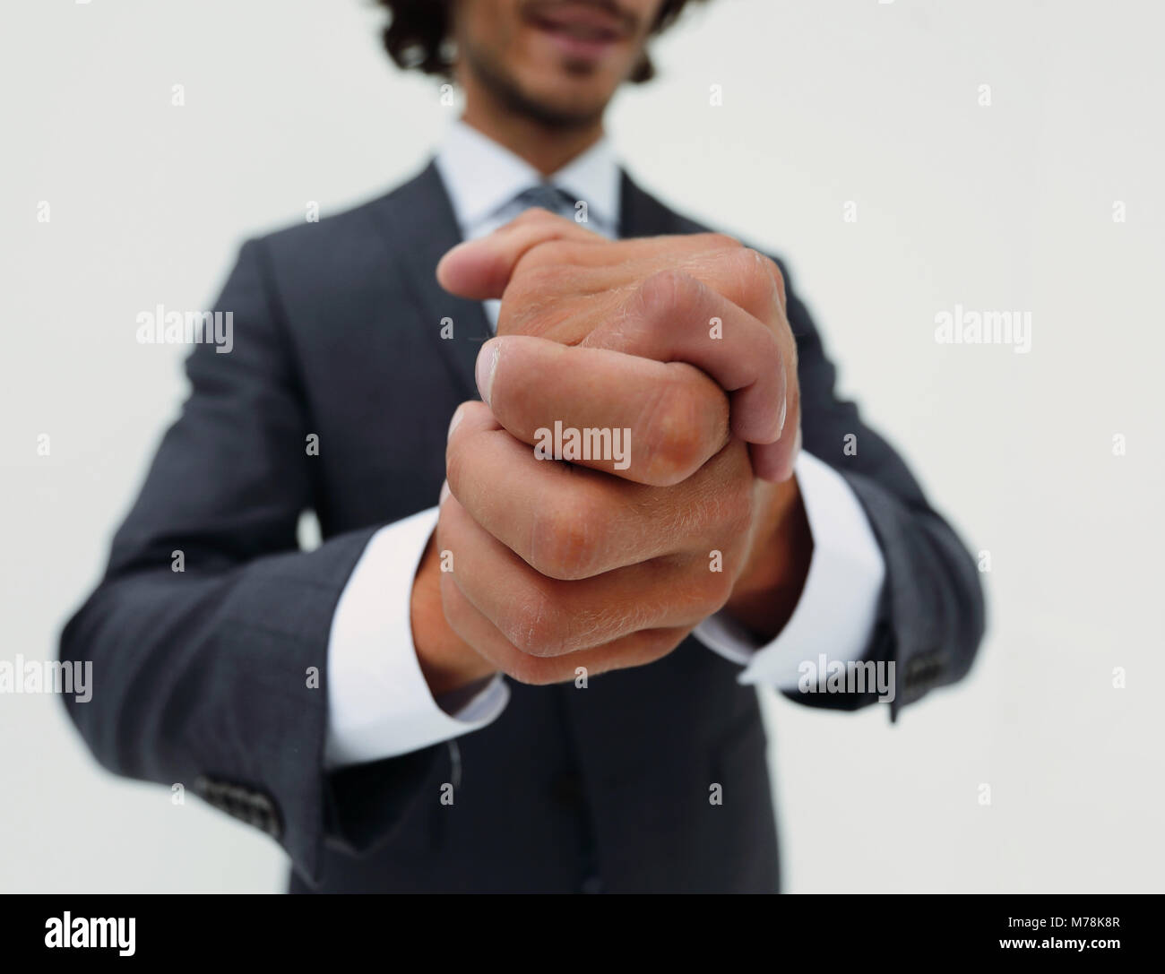 young businessman in suit, rubbing his hands. emotions and people ...