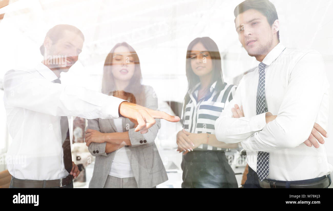 from behind the glass.successful business team.business background ...