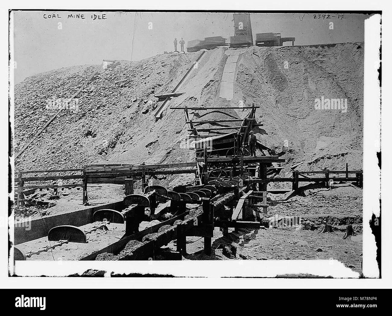 An idle coal mine is shown in this photograph, reflecting the ...