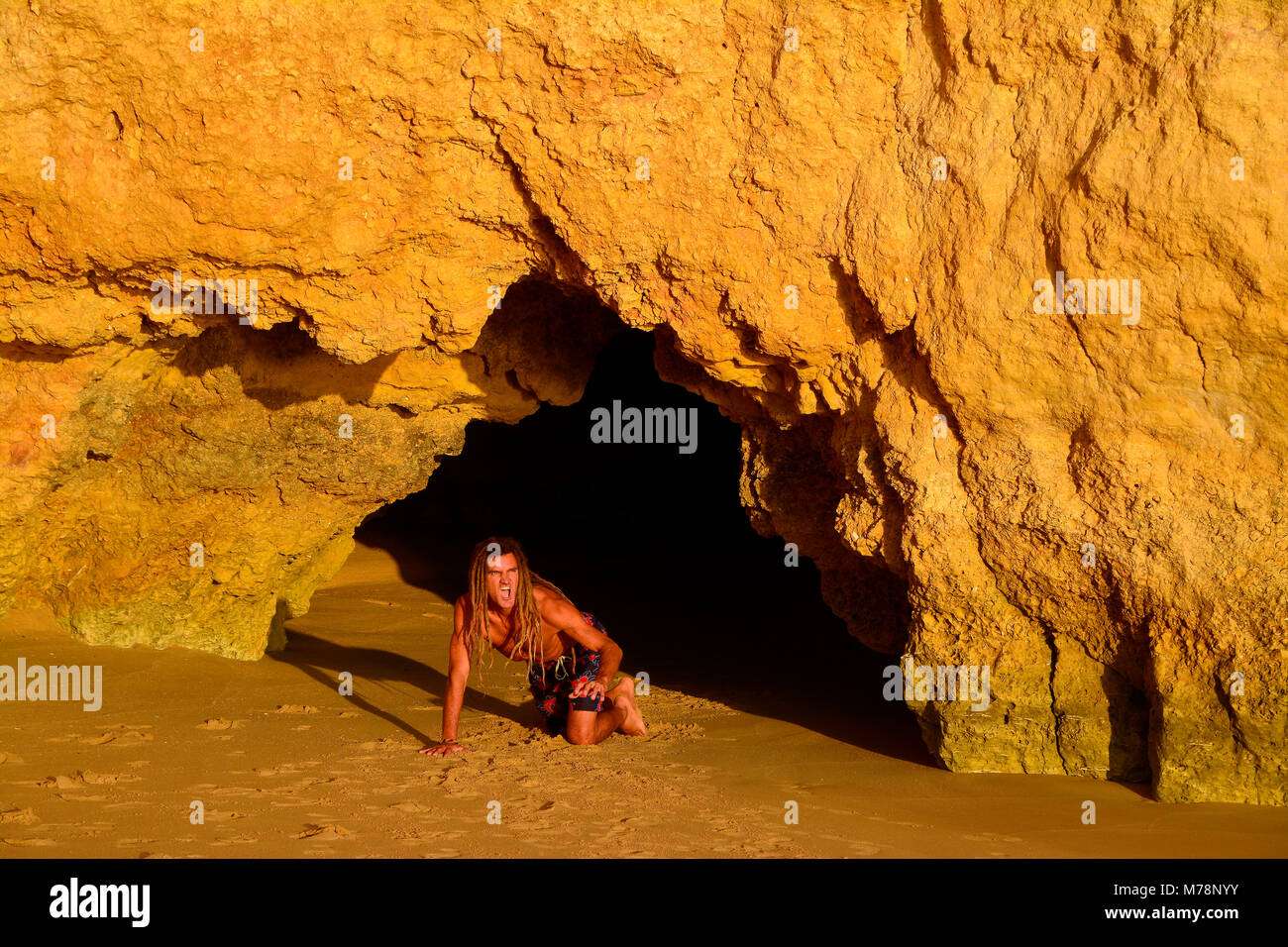 Human coming out of the cave in Portimao (Portugal). Sasha coming out ...