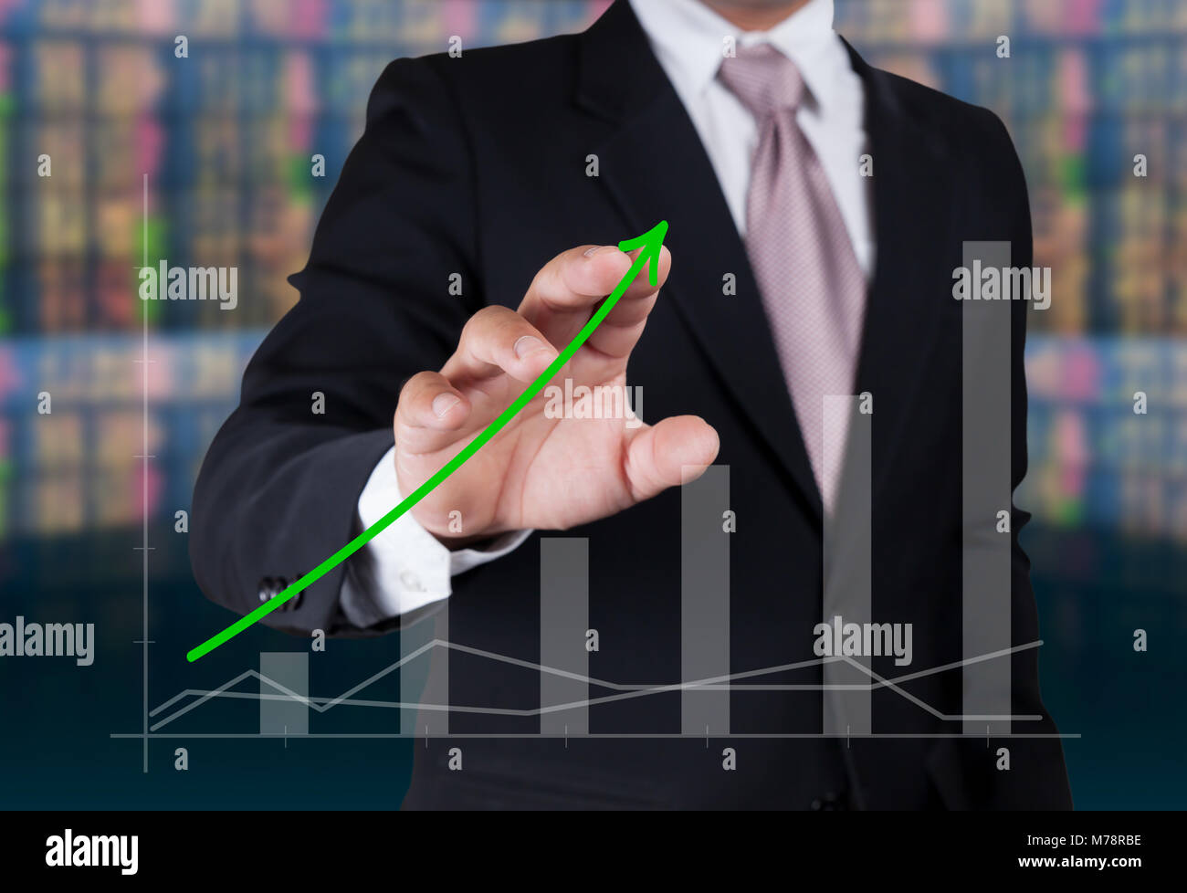 Investor with growth chart of profits Stock Photo - Alamy