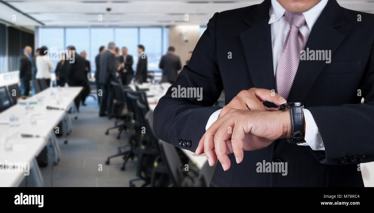Leader looking time Stock Photo - Alamy