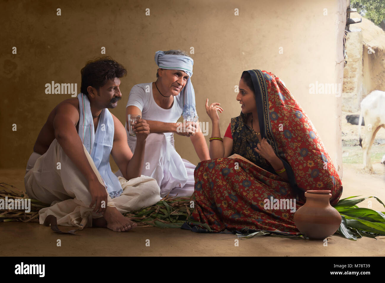 Two farmer talking with rural woman Stock Photo - Alamy