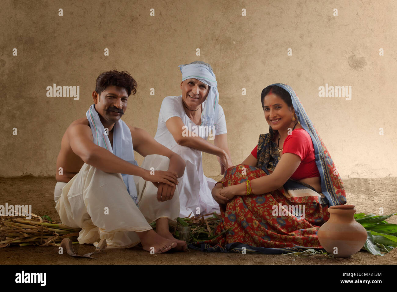 Rural family sitting together Stock Photo - Alamy
