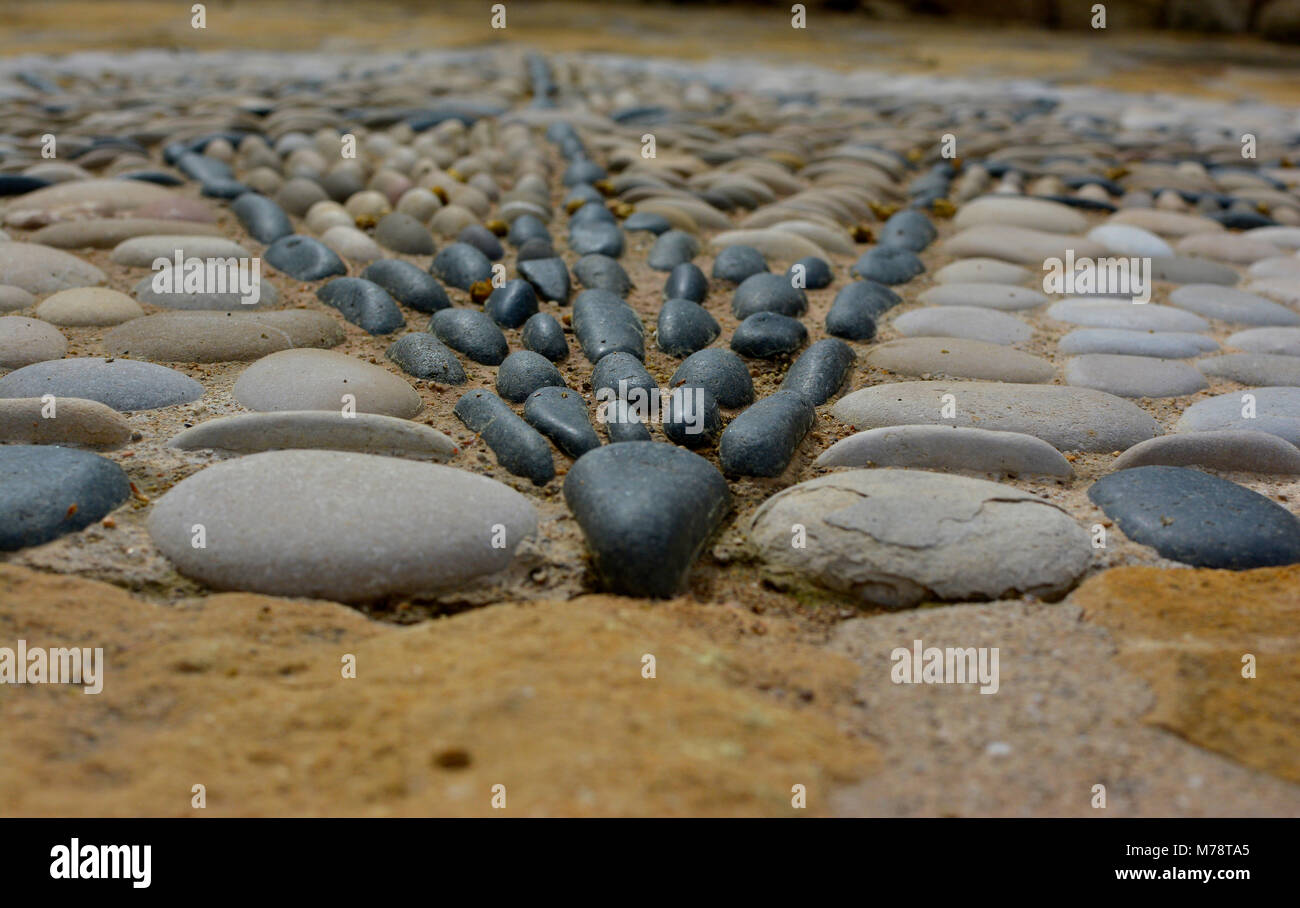 Direction sign on stone alley Stock Photo - Alamy