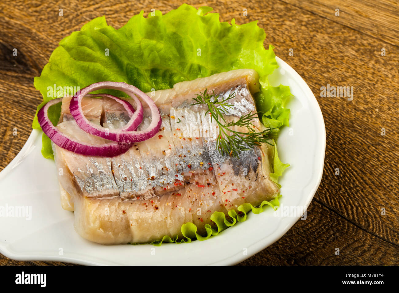 Sliced Herring fillet with dill and onion Stock Photo - Alamy