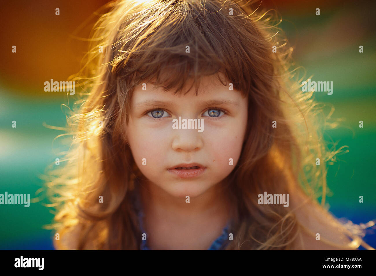 Portrait of a beautiful little girl looking at camera. Close-up Stock ...