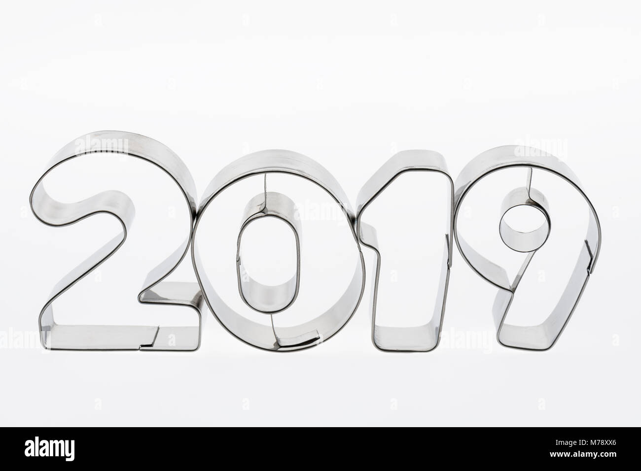 Text two thousand nineteen in metal put figures on a white background ...