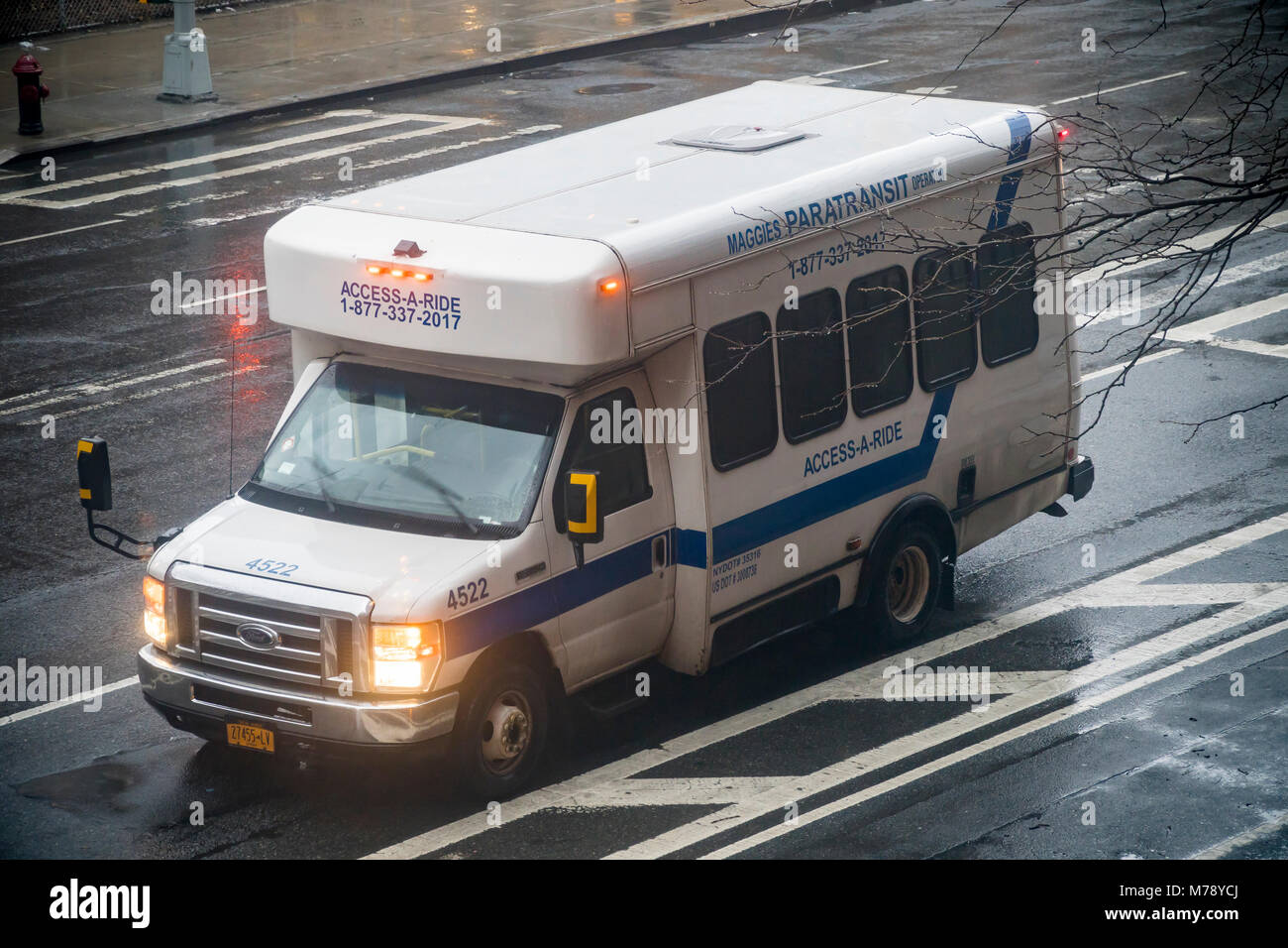 An Access-A-Ride vehicle waits for their passenger during inclement ...