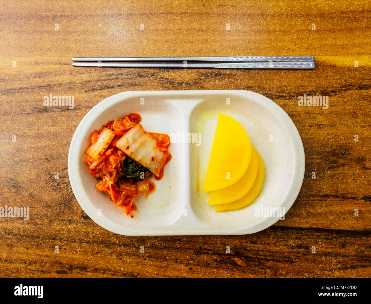 Traditional Korean fermented food kimchi and radish with chopsticks ...