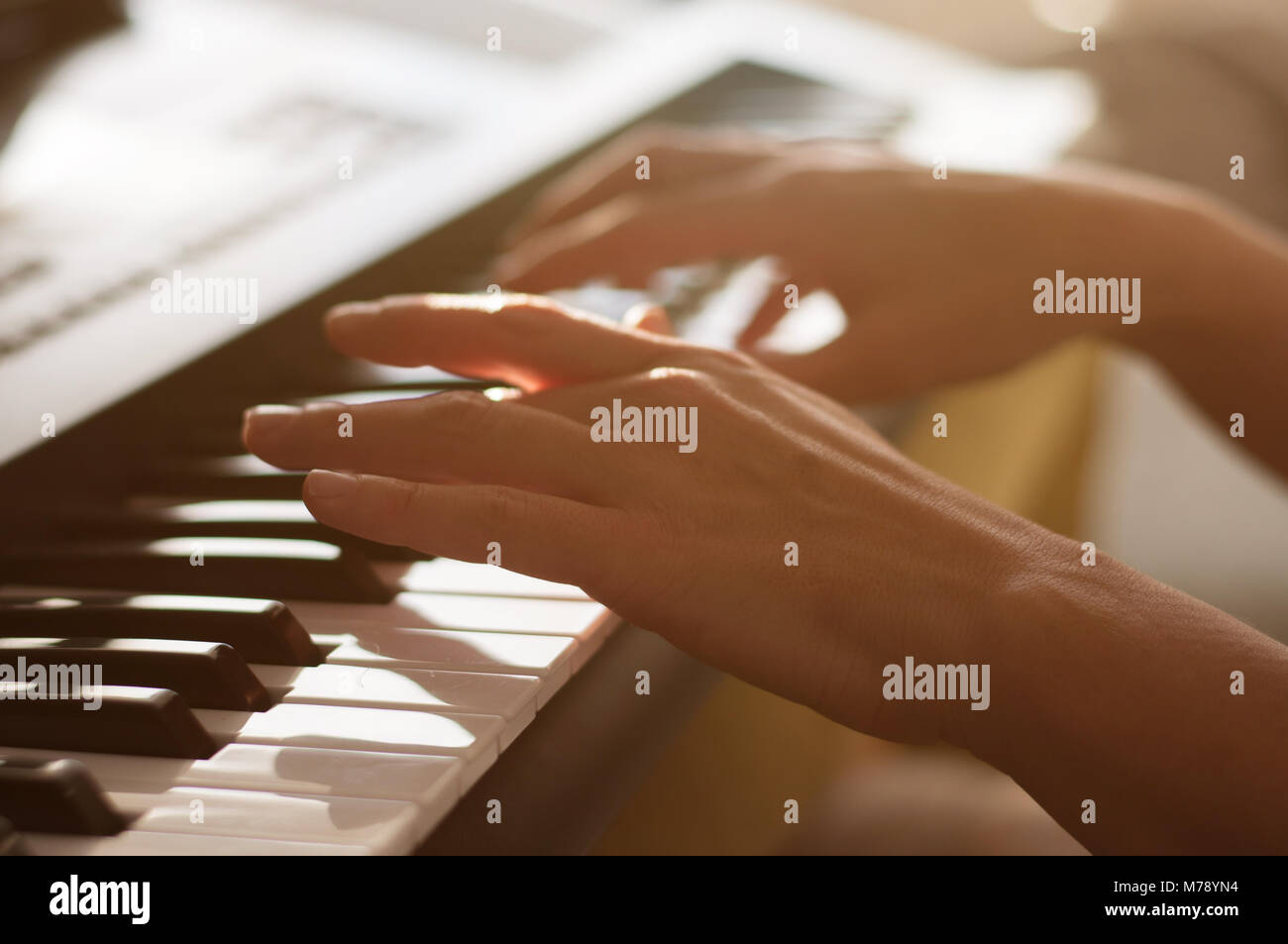 hands of the girl playing the piano close-up Stock Photo - Alamy