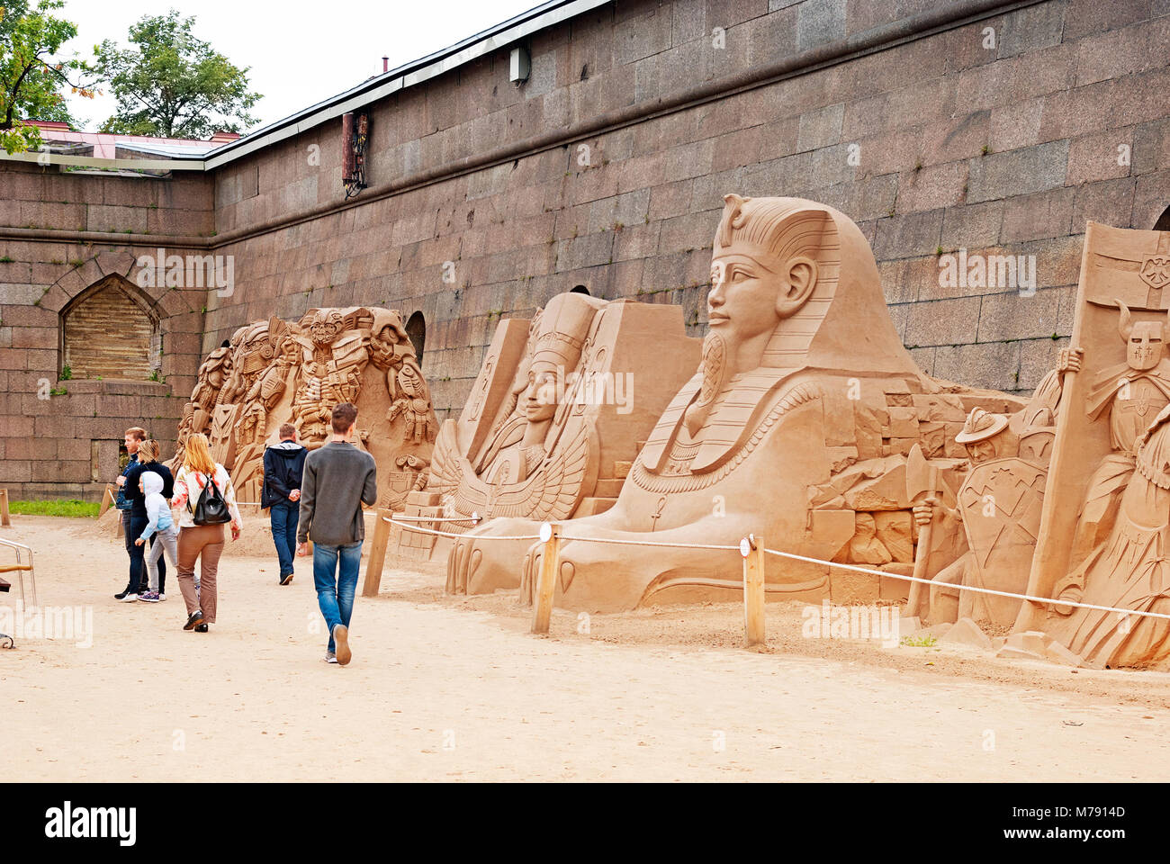 People look at the sand sculptures on The Sand Sculpture Festival near ...