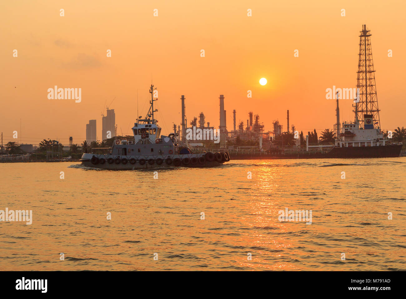 Oil refinery at the river in sunrise time / Big Factory in sunrise time ...