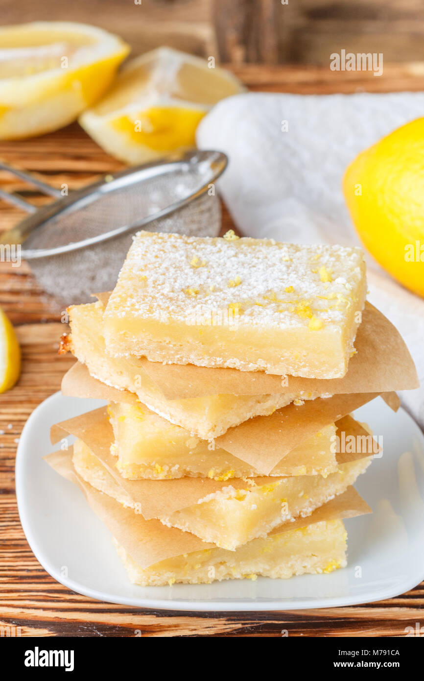 Lemon bars (lemon squares) with powdered sugar. A traditional American ...