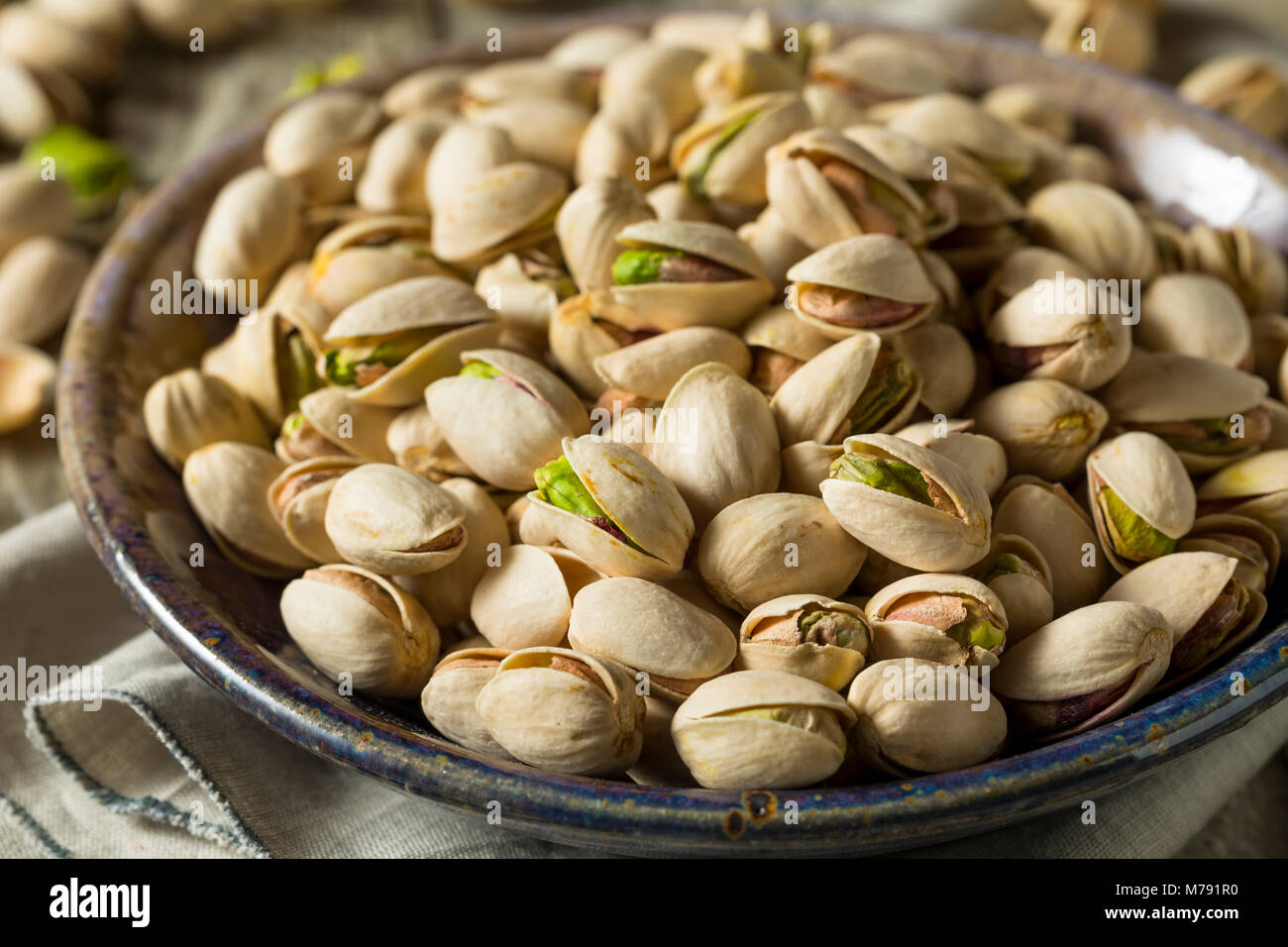 Raw Organic Green Fresh Pistachios in a Bowl Stock Photo - Alamy