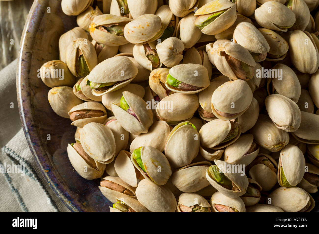 Raw Organic Green Fresh Pistachios in a Bowl Stock Photo - Alamy