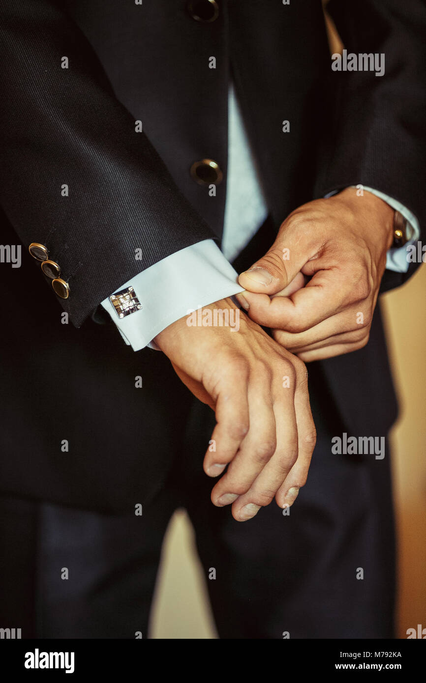 Man fastens shirt hi-res stock photography and images - Alamy