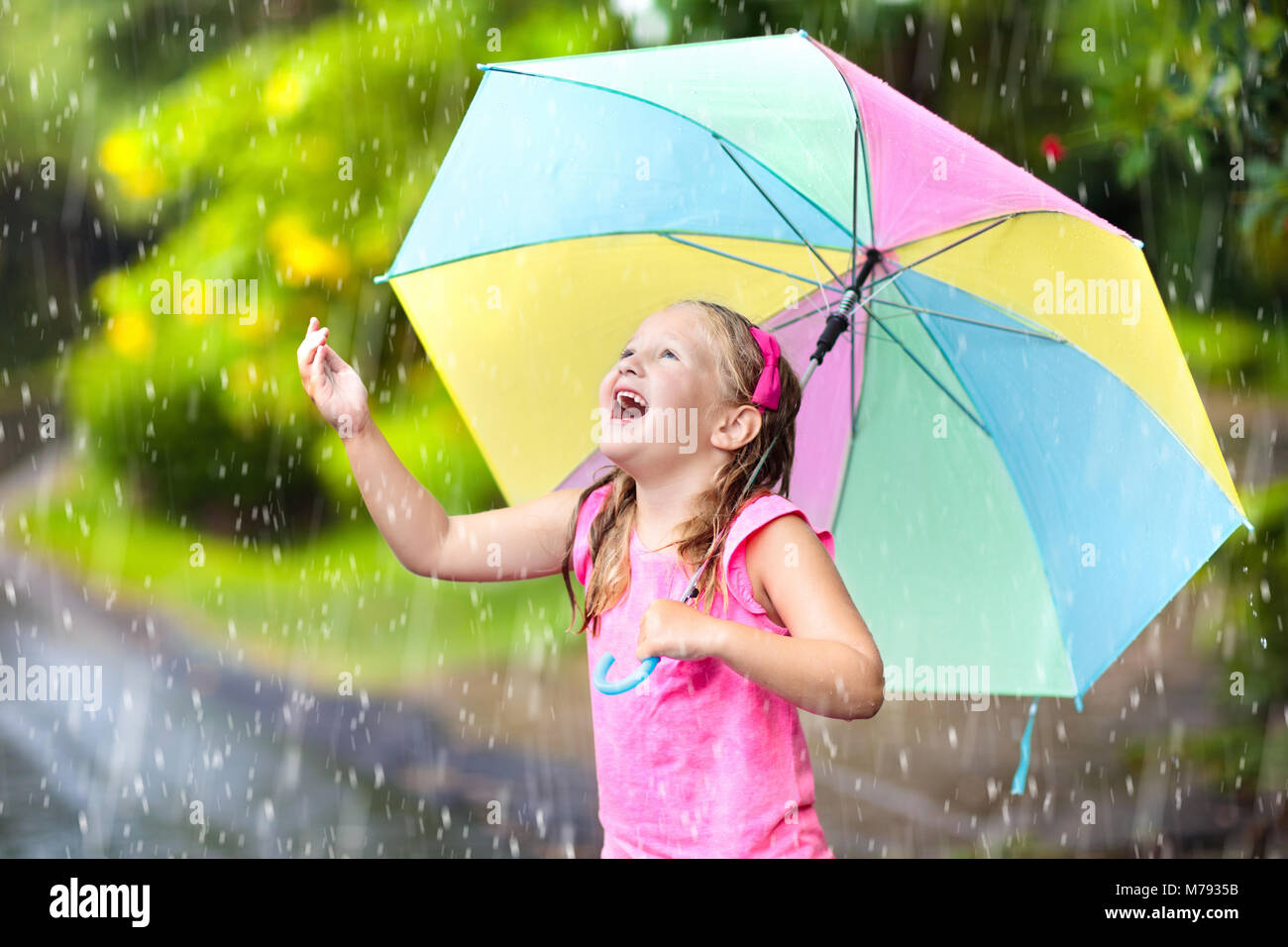 Kids Playing In The Rain