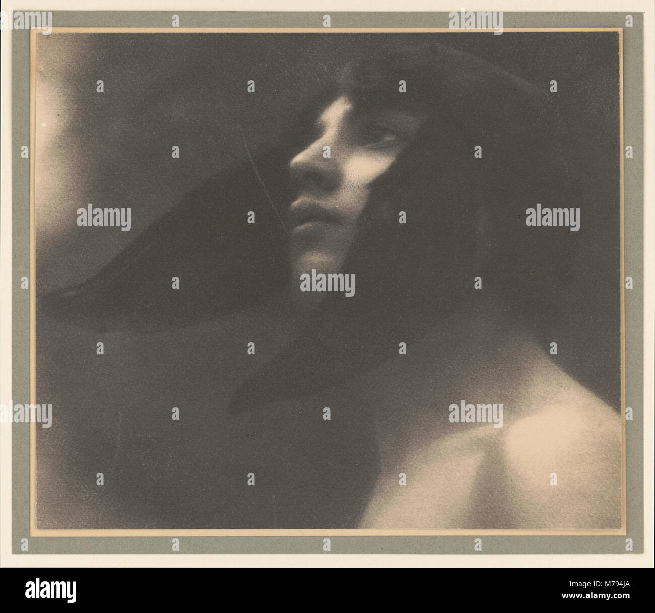 A photograph of a young person wearing a winged hat, cropped at the ...