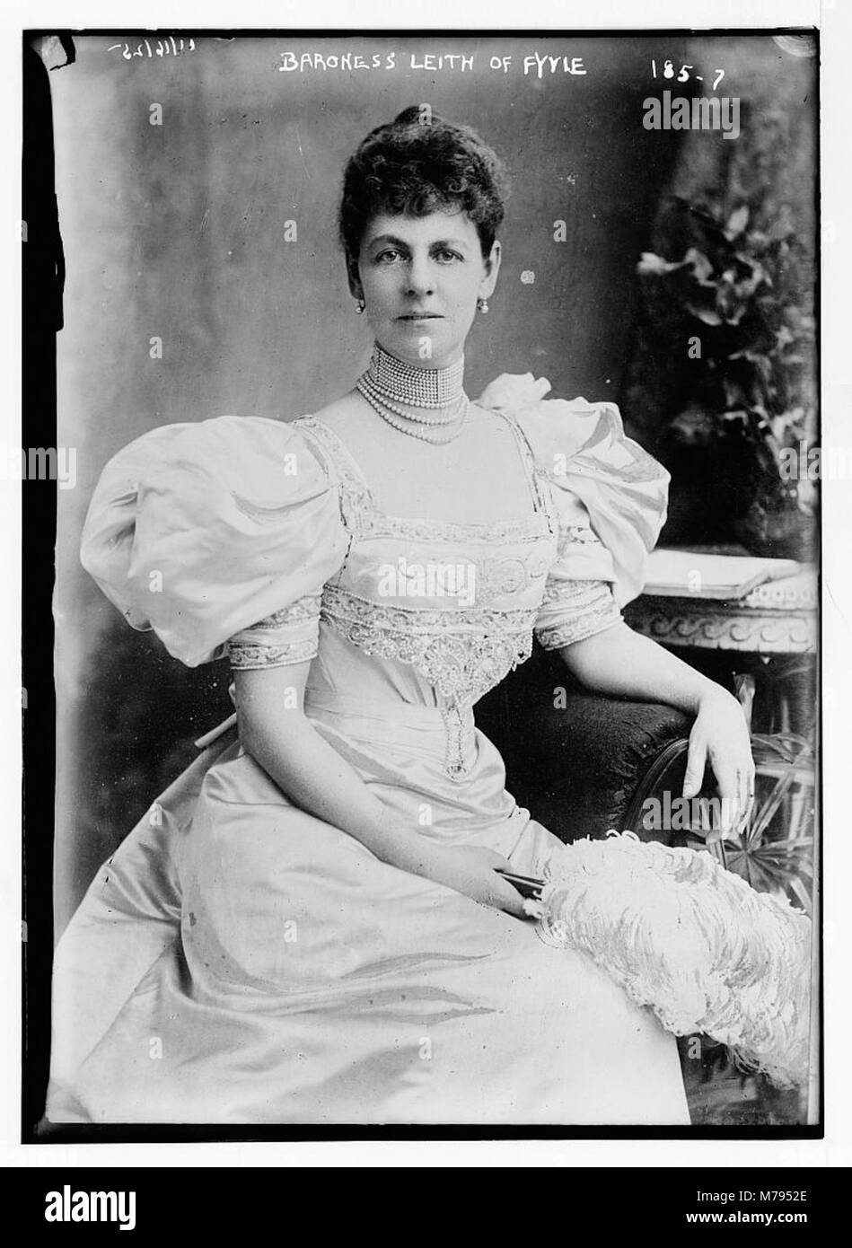 A formal portrait of Baroness Leith of Fyvie, seated in an elegant ...