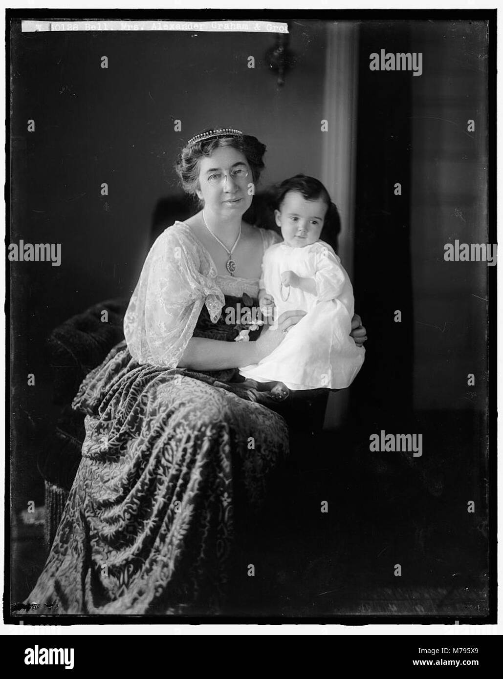 A photograph of Mrs. Alexander Graham Bell with their child, capturing ...