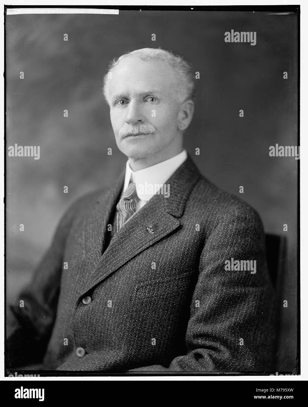 Portrait of Charles W. Bell, an honorable figure, captured in a ...