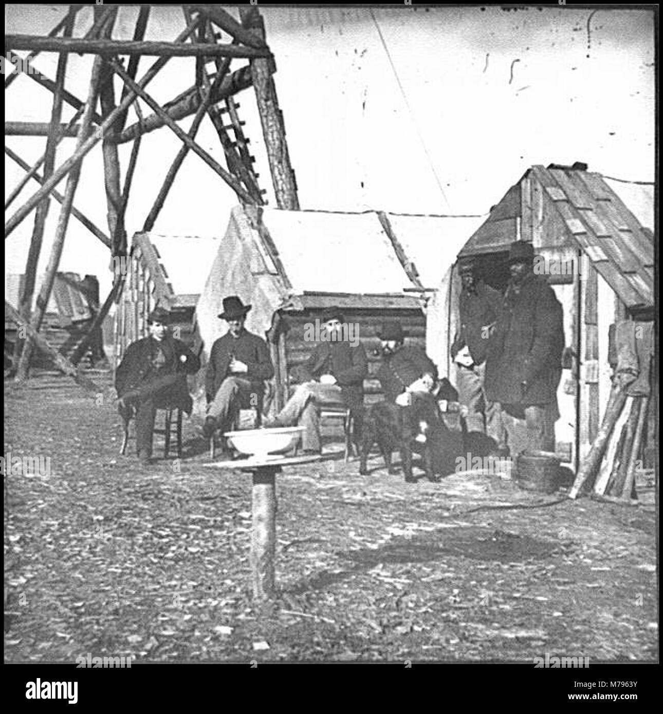 A photograph of officers at Bermuda Hundred, Virginia, positioned near ...