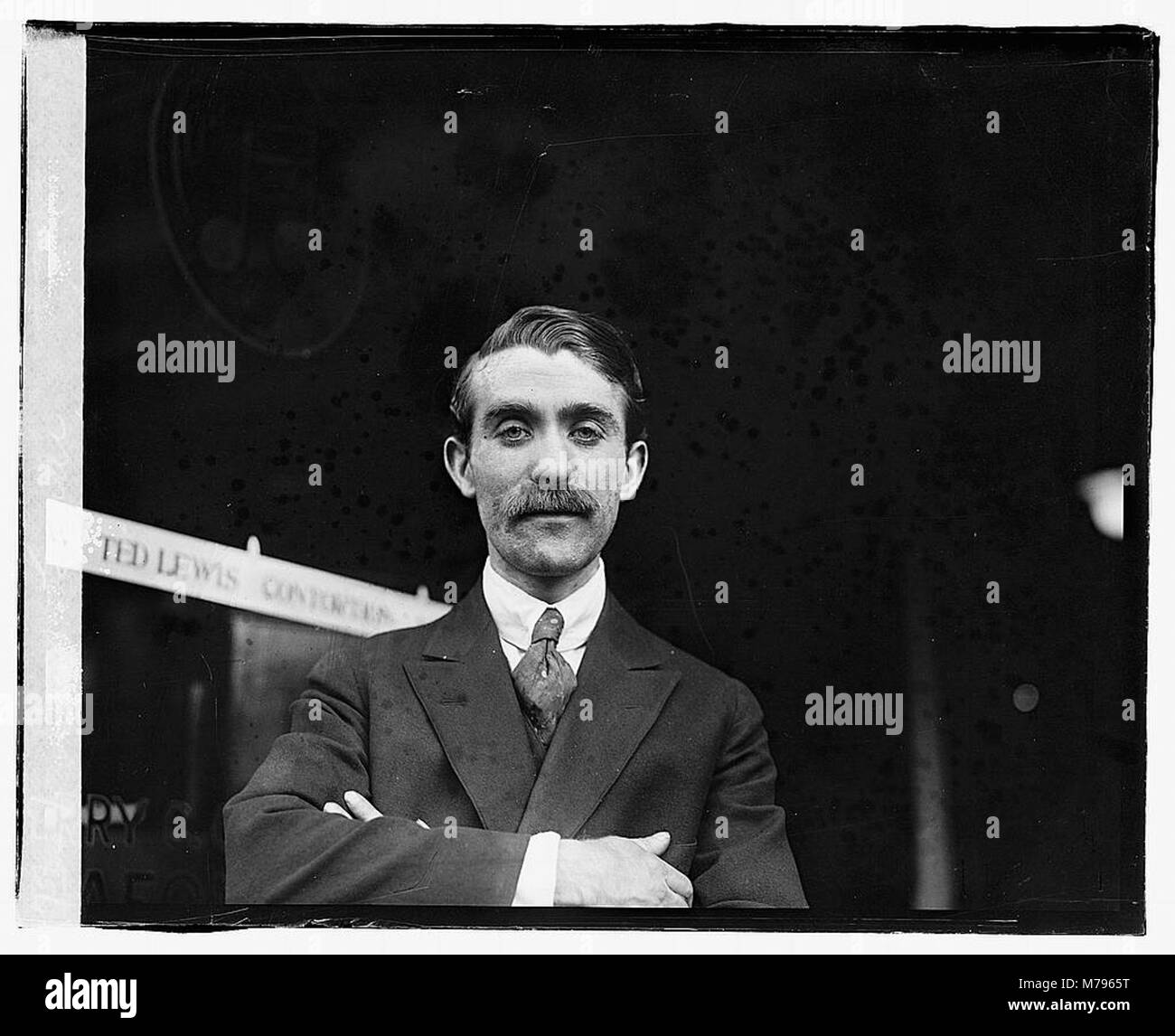 A portrait of Bert Sarai, likely a prominent figure, captured in a ...