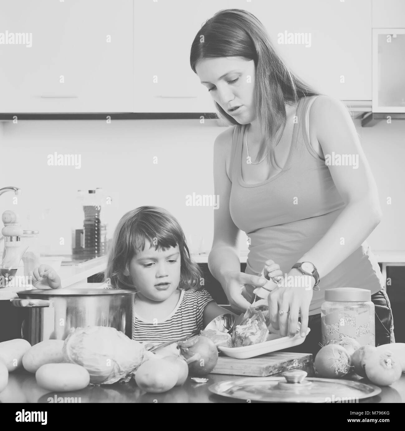 Female mother cooking Black and White Stock Photos & Images - Alamy