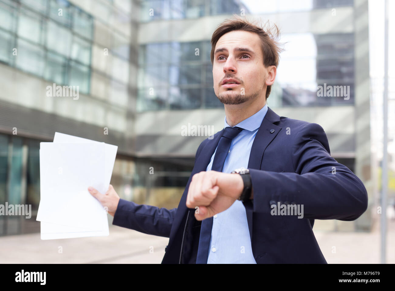 Portrait of busy man in suit rushing to important meeting Stock Photo ...