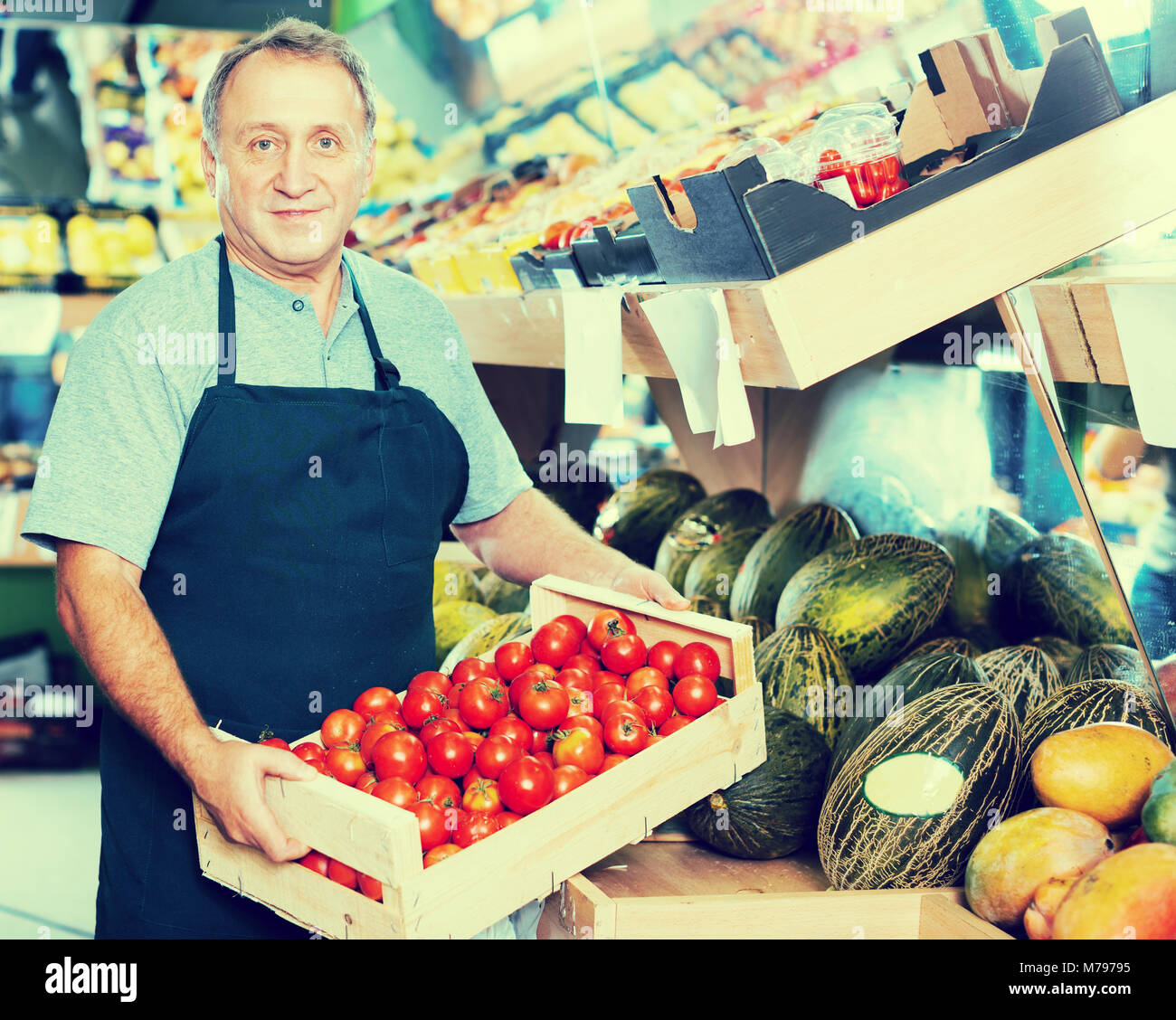 Adult seller offering red hi-res stock photography and images - Alamy
