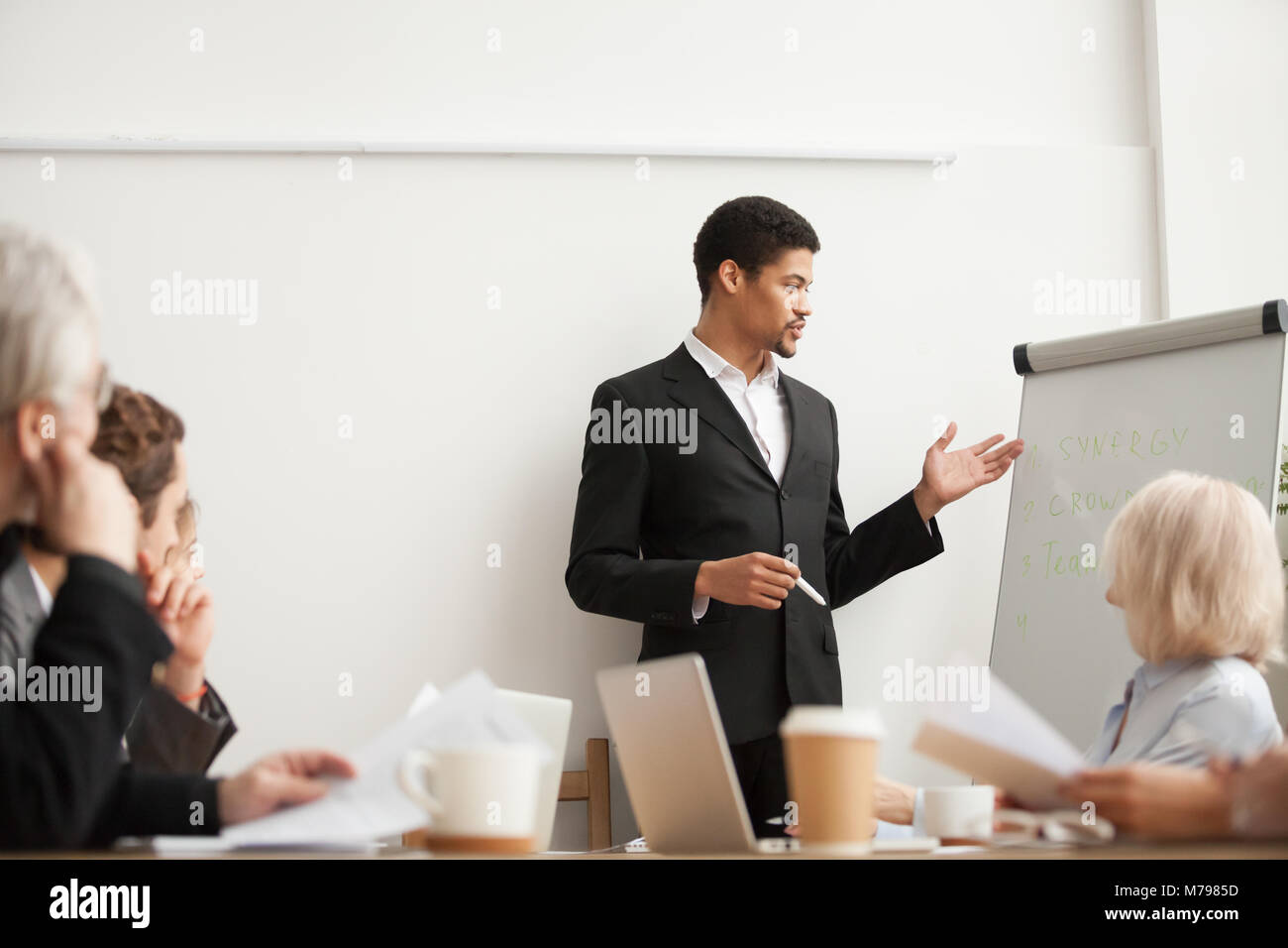 Black boss speaking to employees hi-res stock photography and images - Alamy
