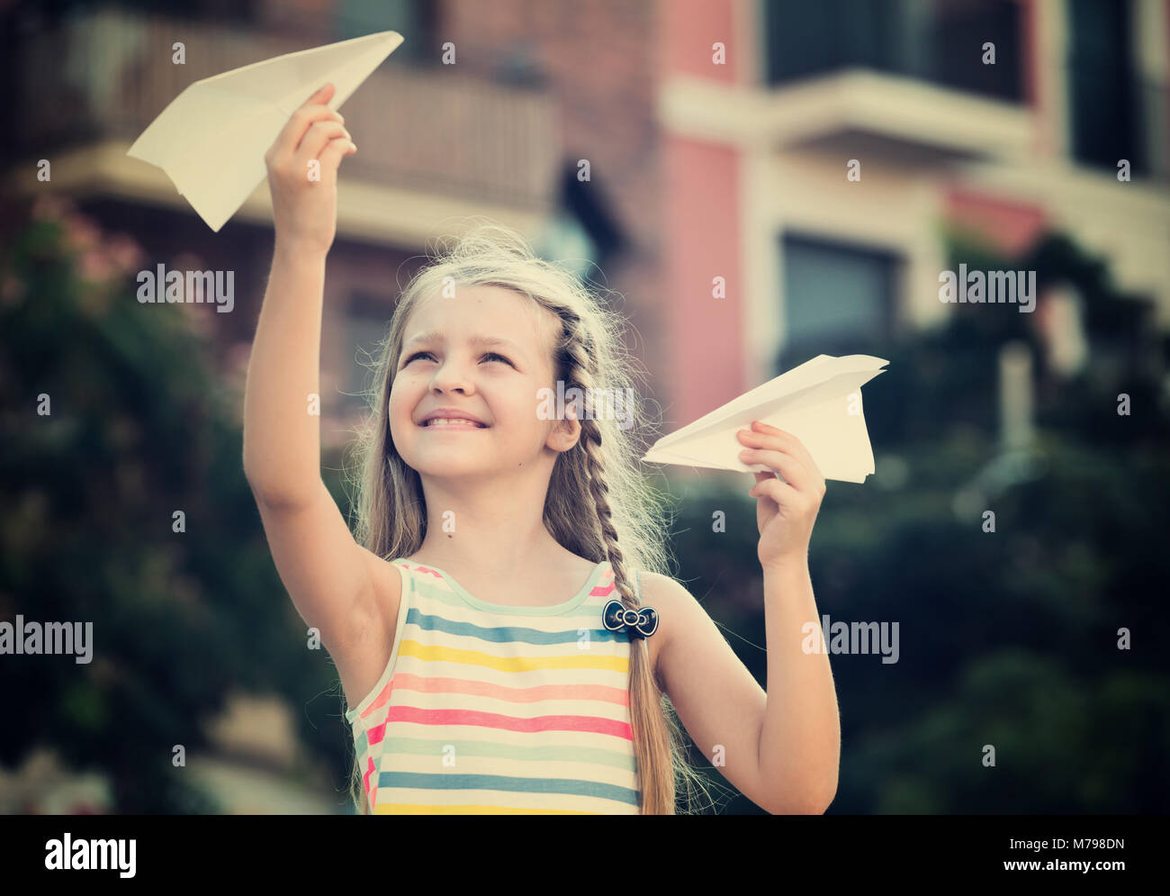 Happy girl throwing simple hi-res stock photography and images - Alamy
