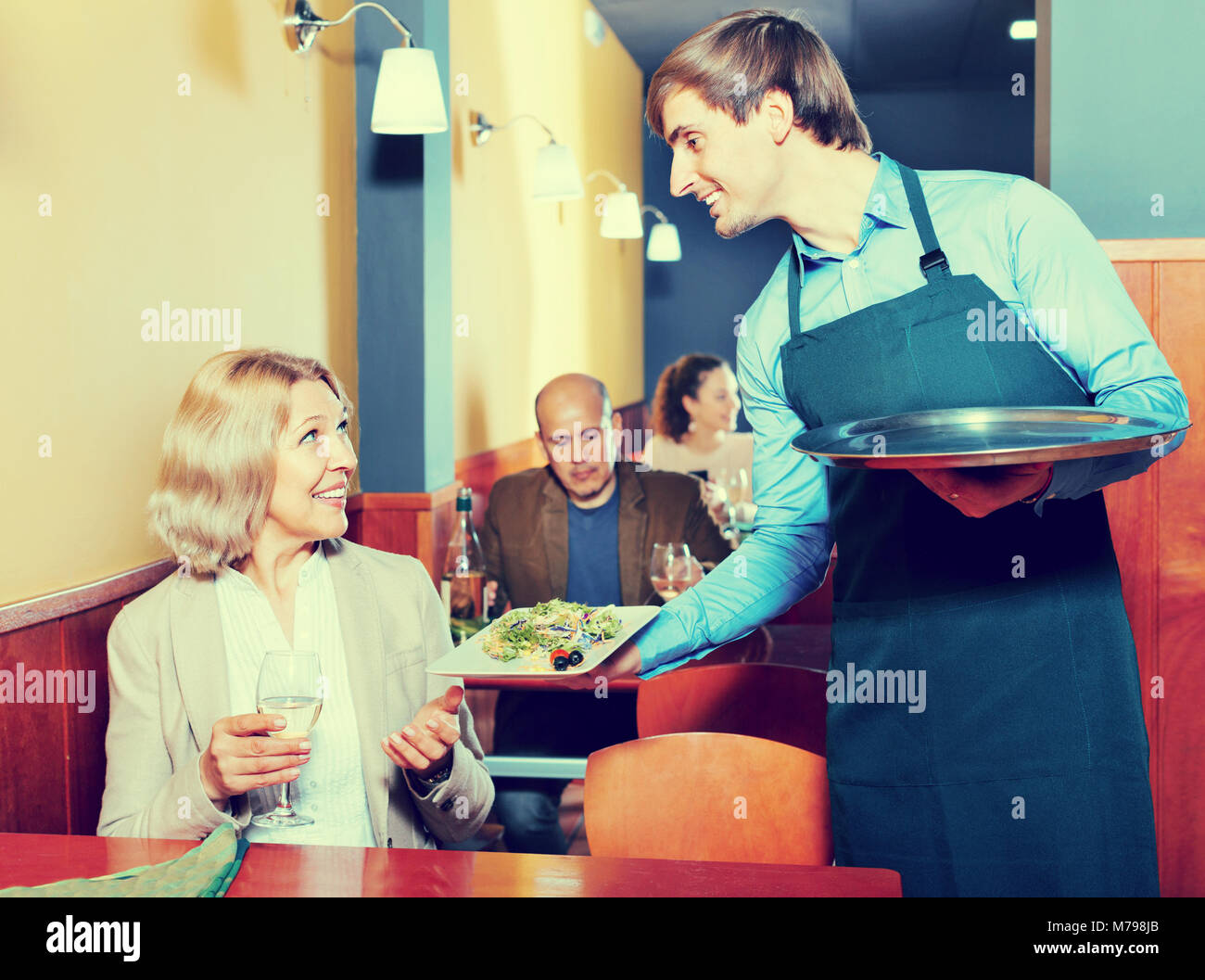 Elderly man dinner laughing young woman hi-res stock photography and ...