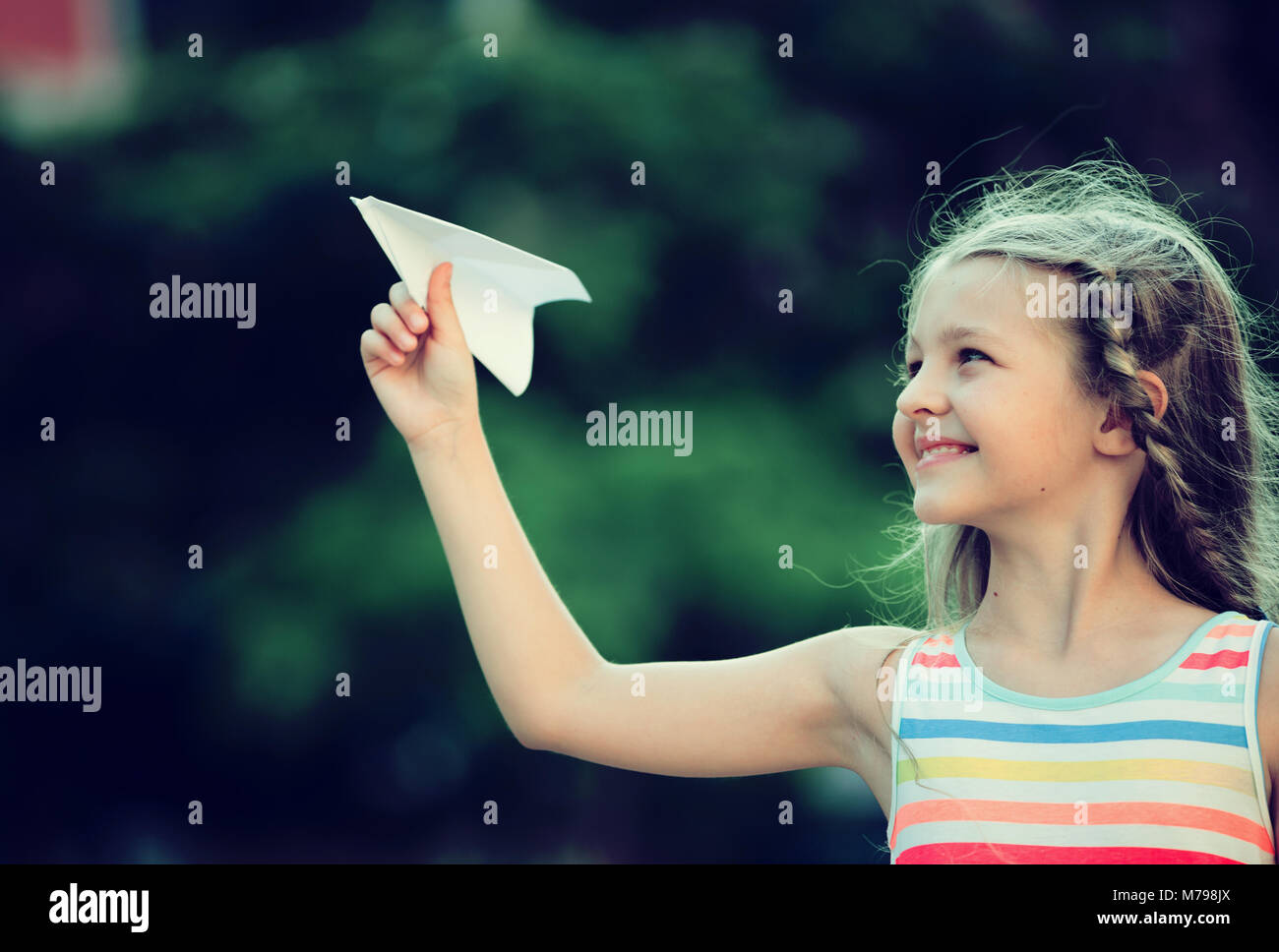 Happy girl throwing simple hi-res stock photography and images - Alamy
