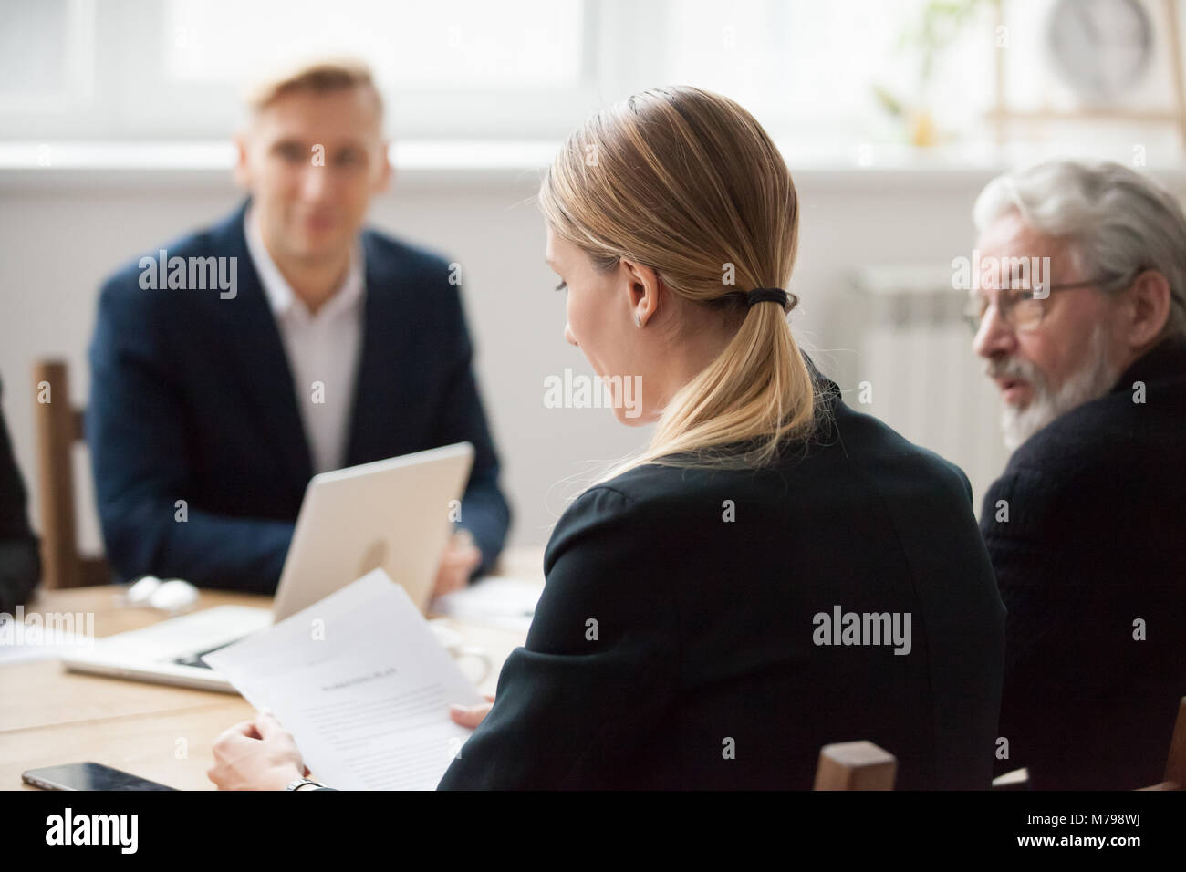 Group checking hi-res stock photography and images - Alamy