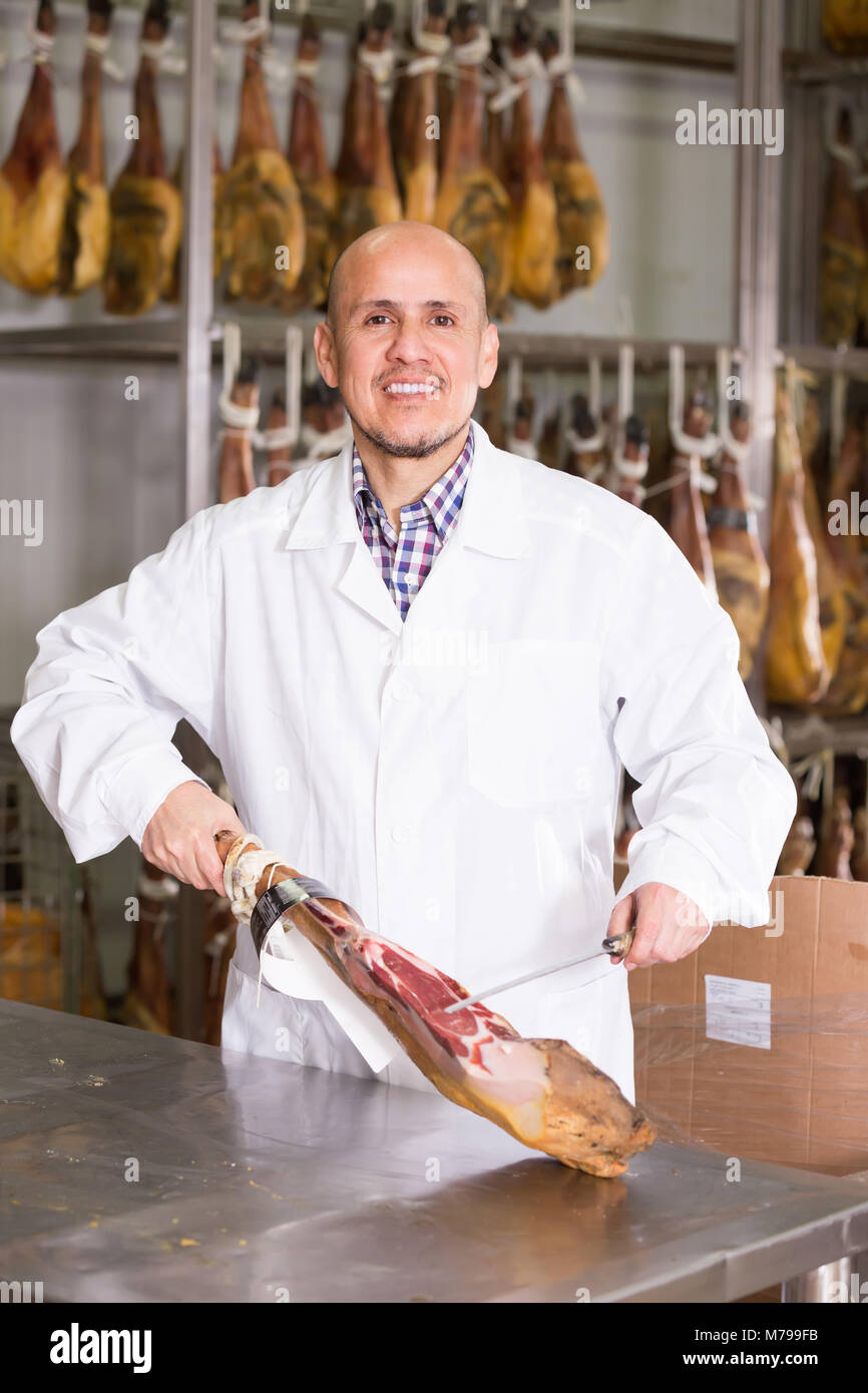 Smiling mature butcher in hi-res stock photography and images - Alamy
