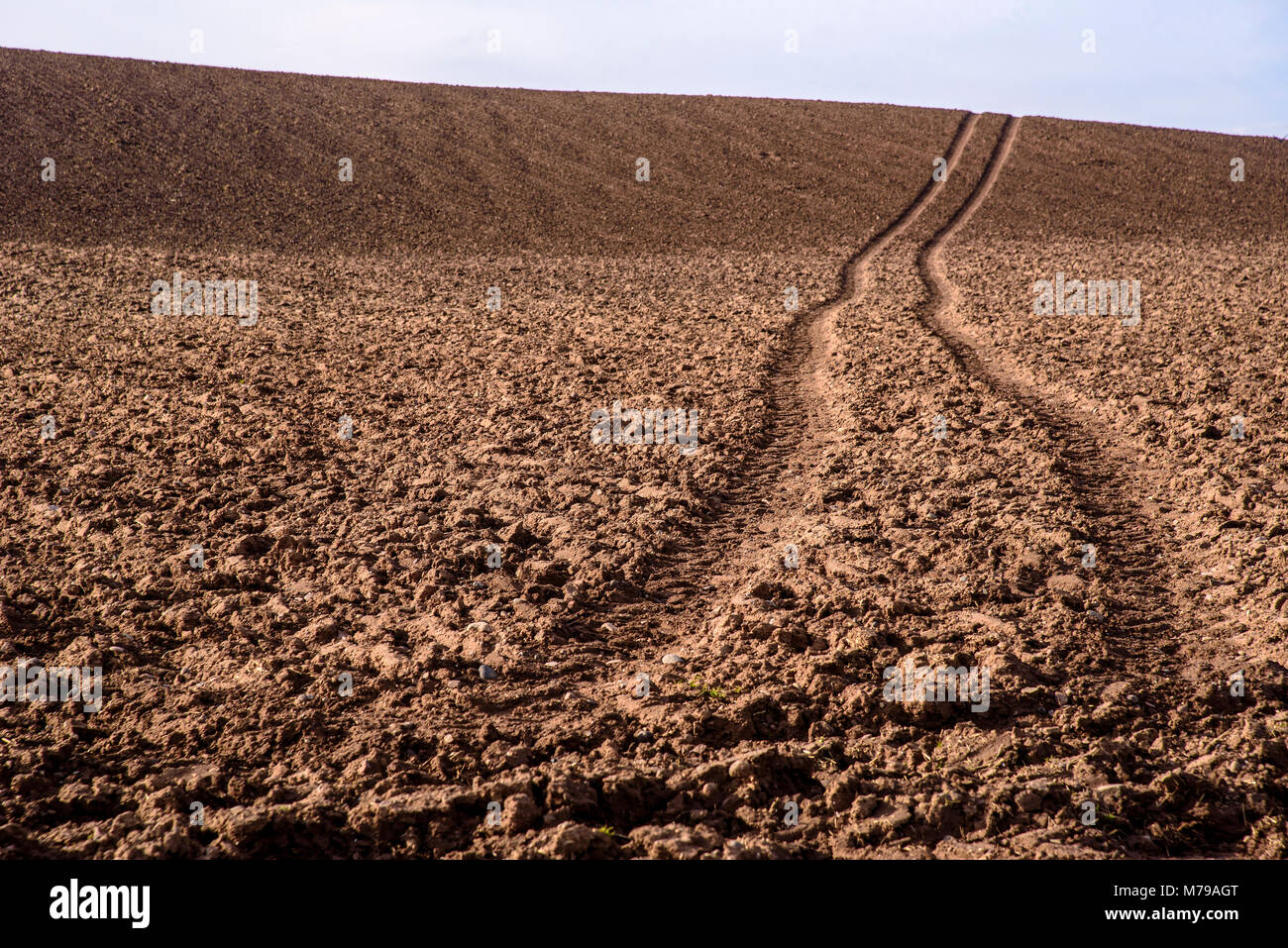 Ploughed field. tractor tyre tracks Stock Photo - Alamy