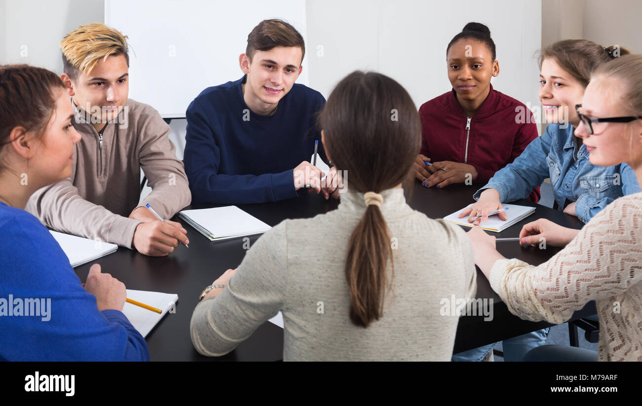 thoughtful classmates having difficult project to complete during class ...