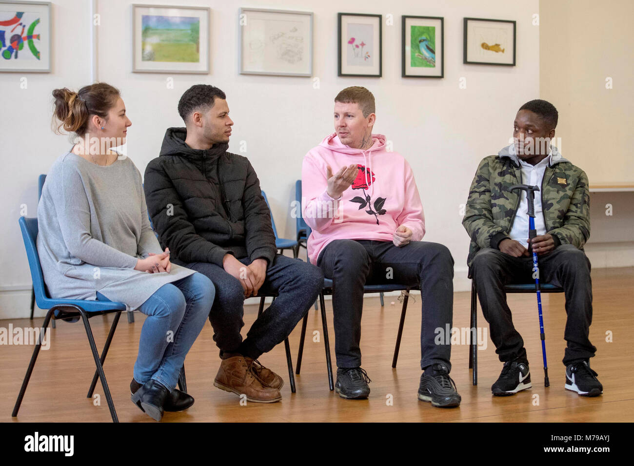 Rapper Professor Green (centre) with service users Tasha, Edward ...