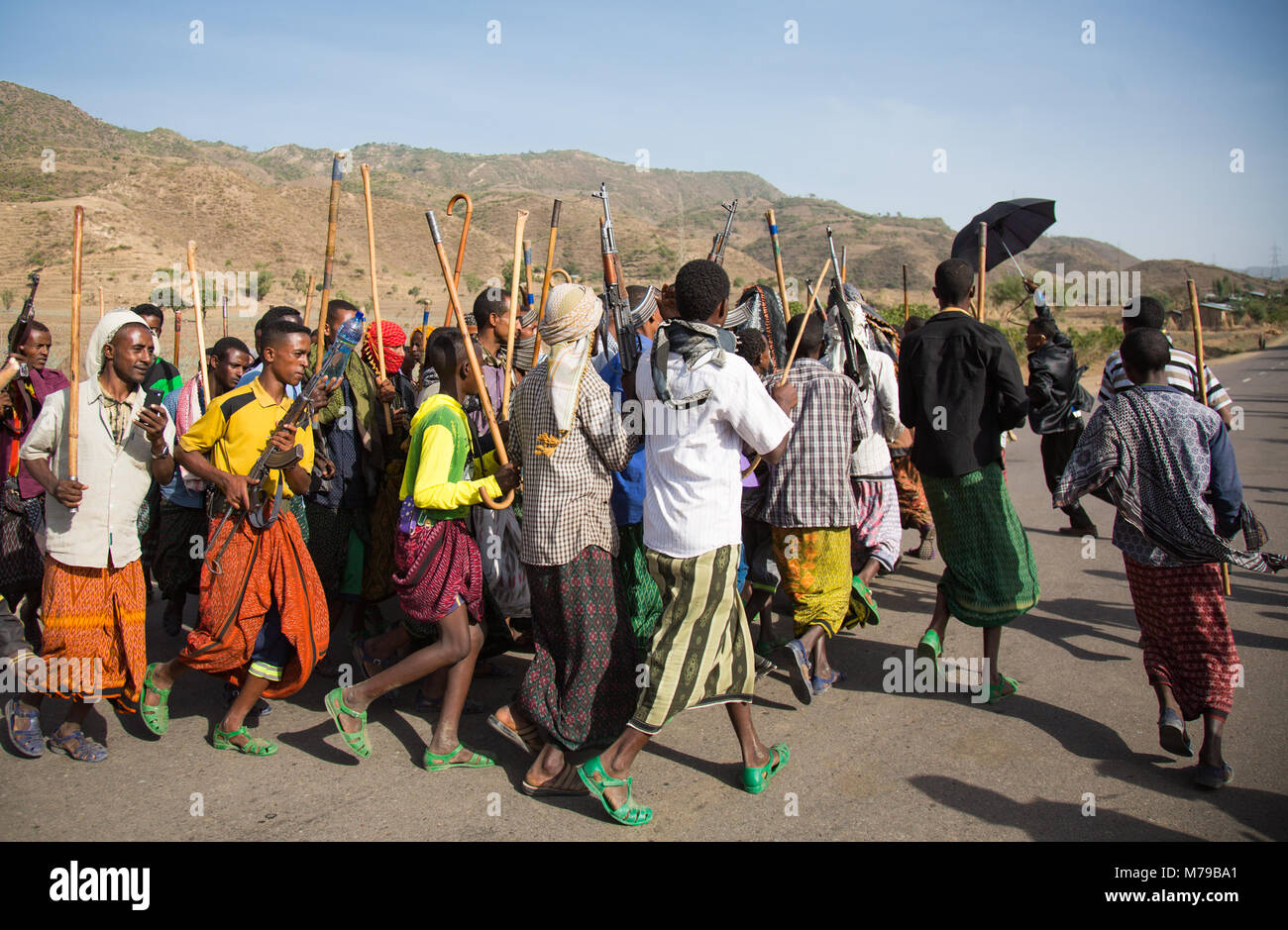 Oromo men and boys with sticks, Canes and weapons dancing and ...
