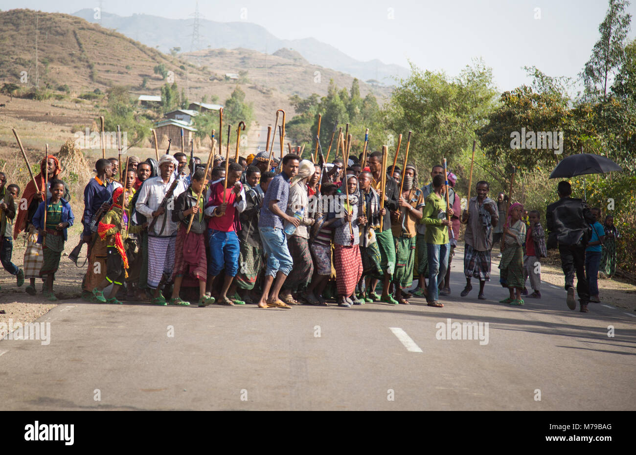 Oromo men and boys with sticks, Canes and weapons dancing and Stock ...
