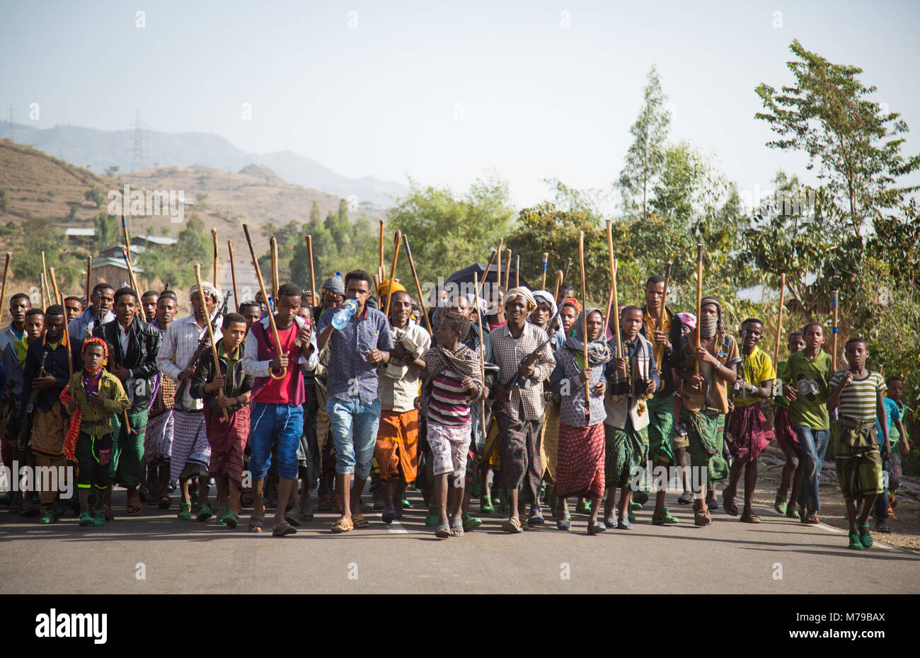 Oromo men and boys with sticks, Canes and weapons dancing and ...